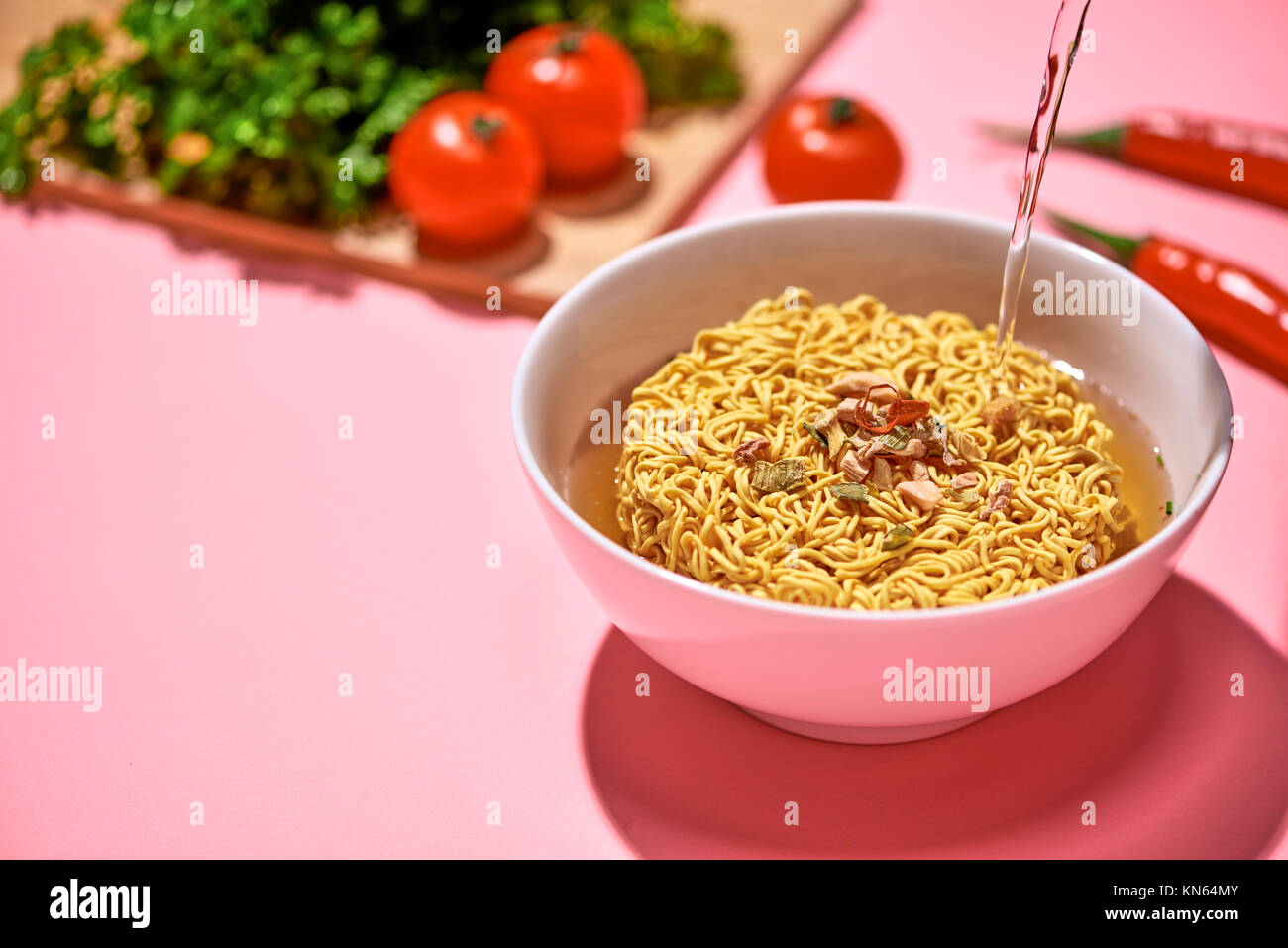 Cooking instant noodles, boiling water Stock Photo - Alamy