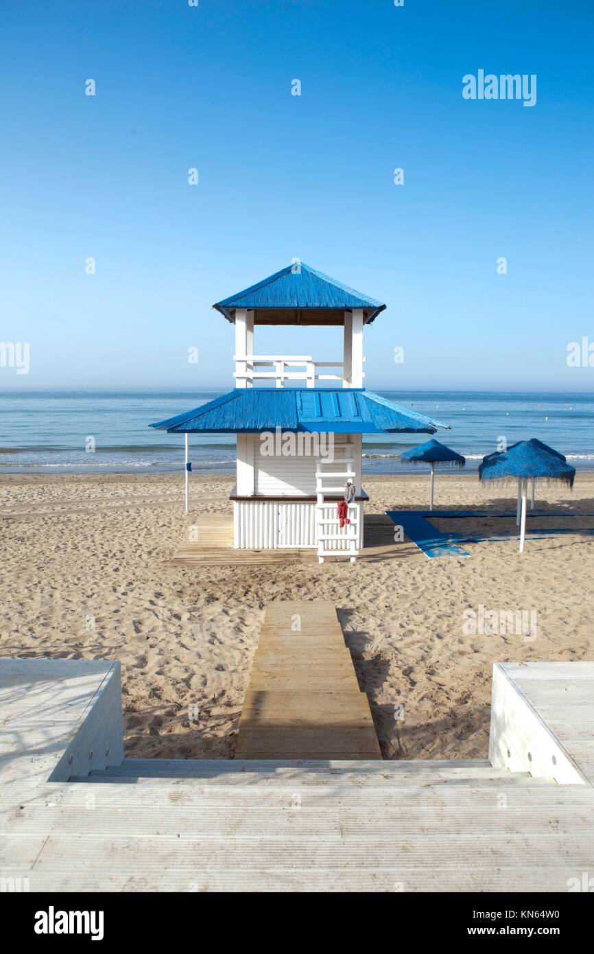 Wooden blue and white beach refreshments stand at beautiful white beach ...