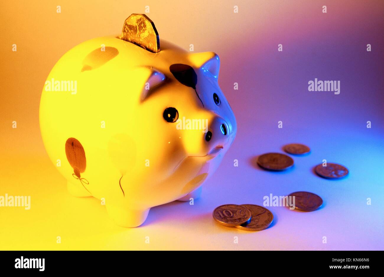 Piggy bank and coins Stock Photo - Alamy