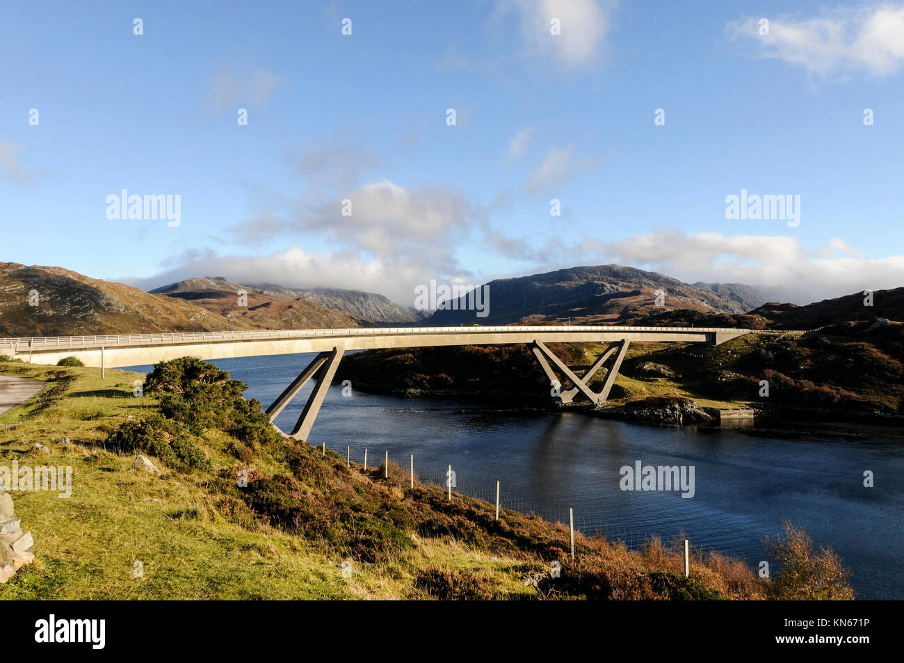 The modern Kylesku bridge carries the A894 road over Loch Glencoul in ...