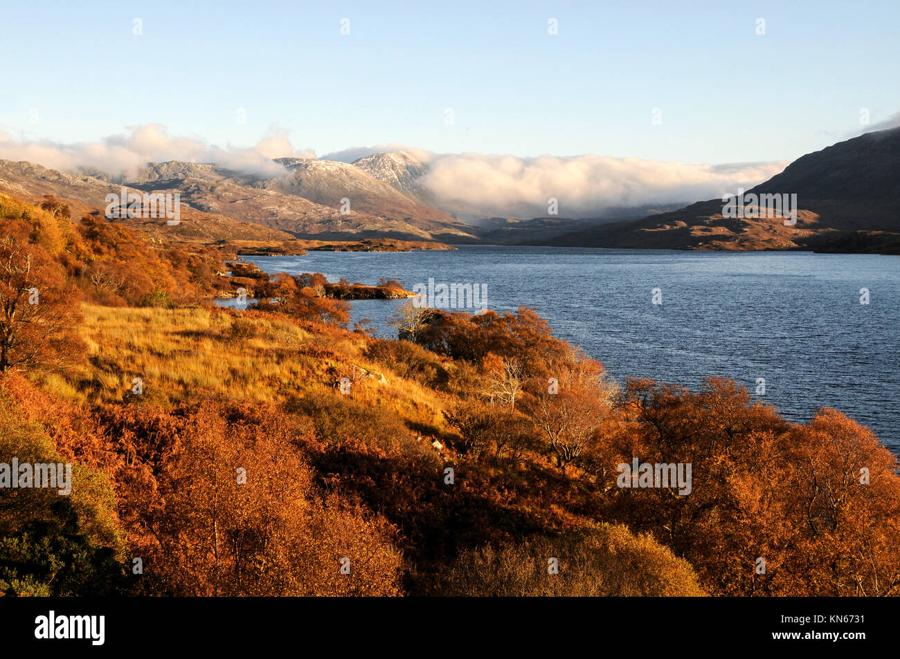 An autumn sunset cast its red colours around Loch Glencoul in ...