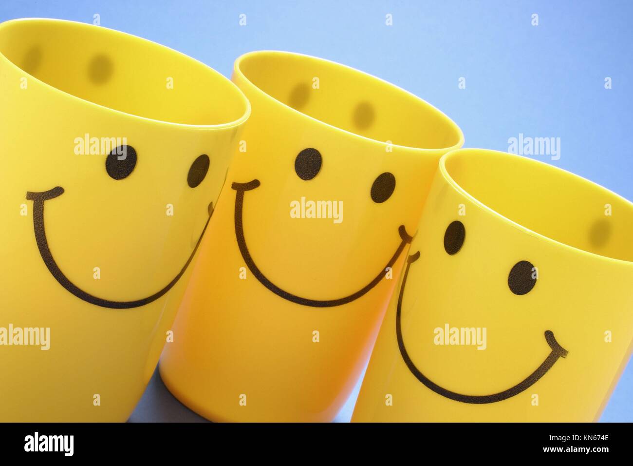 Yellow smiley face cup hi-res stock photography and images - Alamy