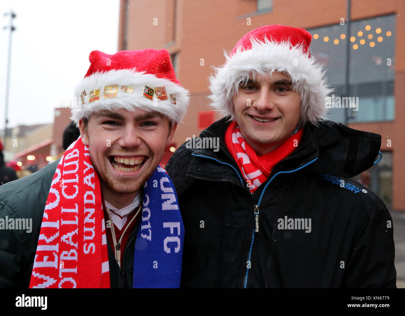 Fans pose for photo prior to the Premier League match at Anfield ...