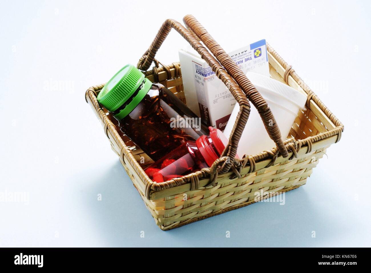 Pill Bottles in Basket Stock Photo - Alamy
