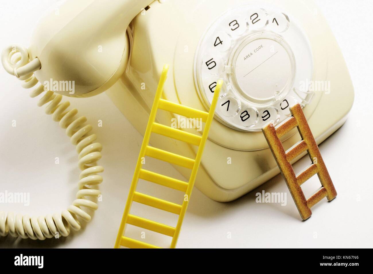 Telephone and toy ladders Stock Photo - Alamy