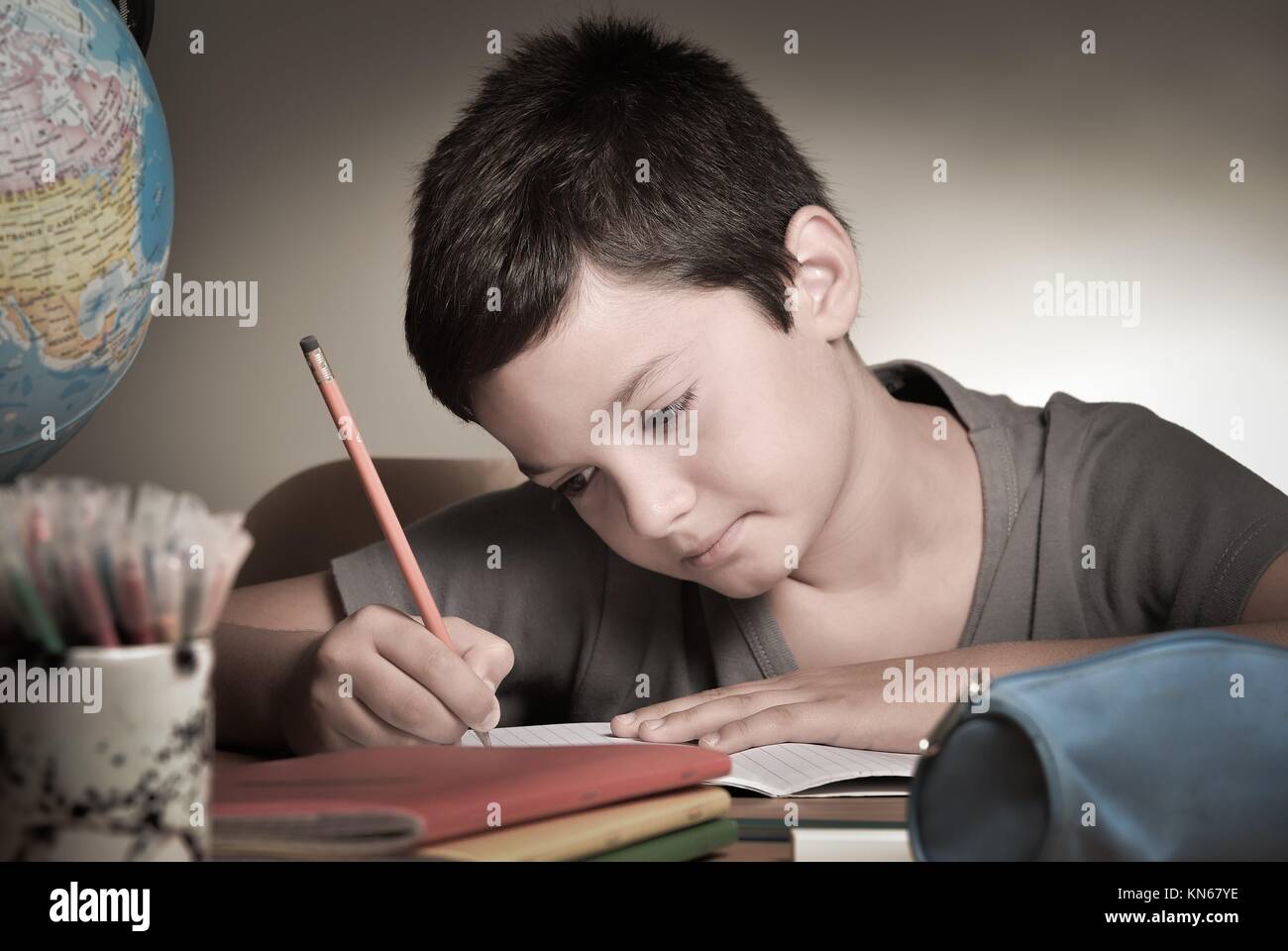 Elementary age kid writing hi-res stock photography and images - Alamy