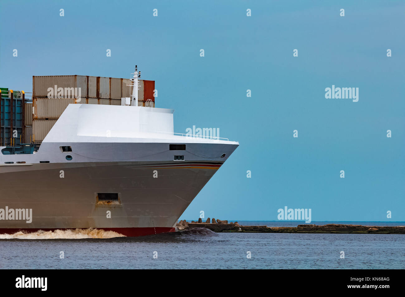 Grey container ship. Logistics and production import Stock Photo - Alamy