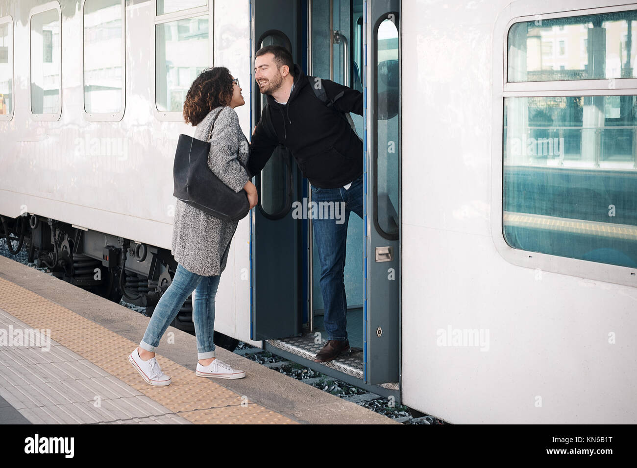 Love couple hugging before leaving on the train Stock Photo - Alamy