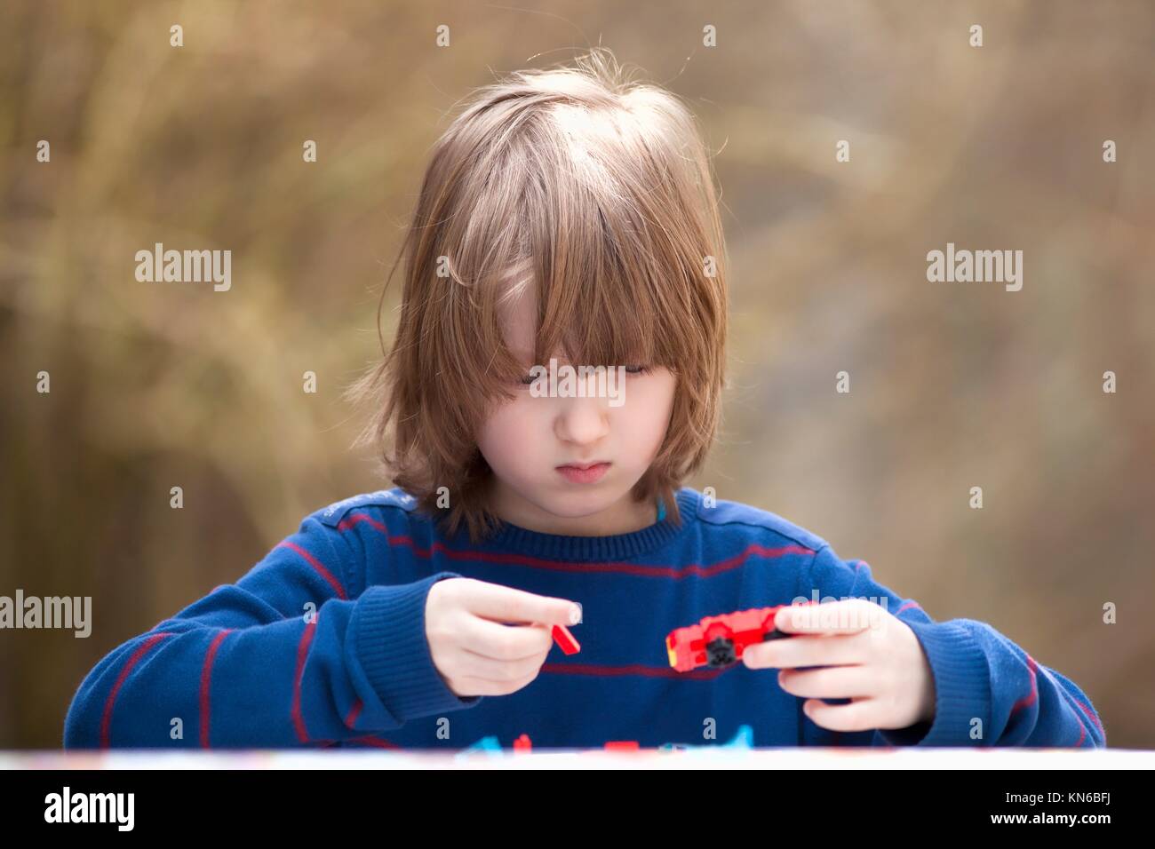 Child assembling toy hi-res stock photography and images - Alamy