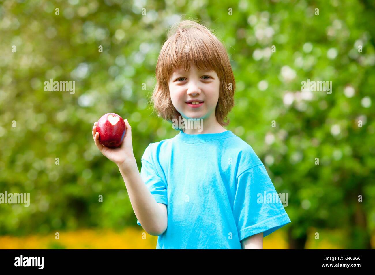 Boy with Red Apple Showing Heart Shaped Bite Off Stock Photo - Alamy
