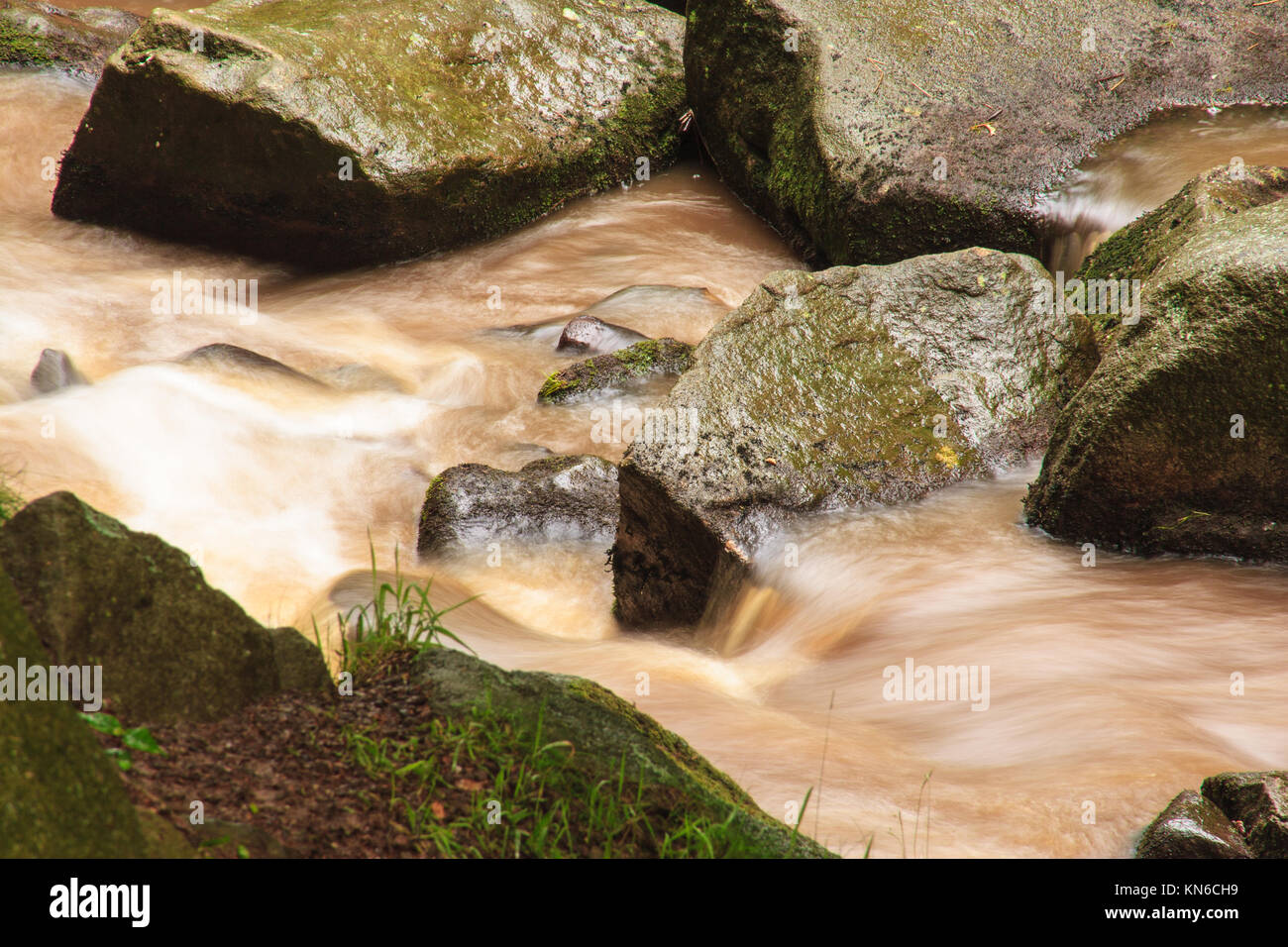Water flowing through rocks Stock Photo - Alamy