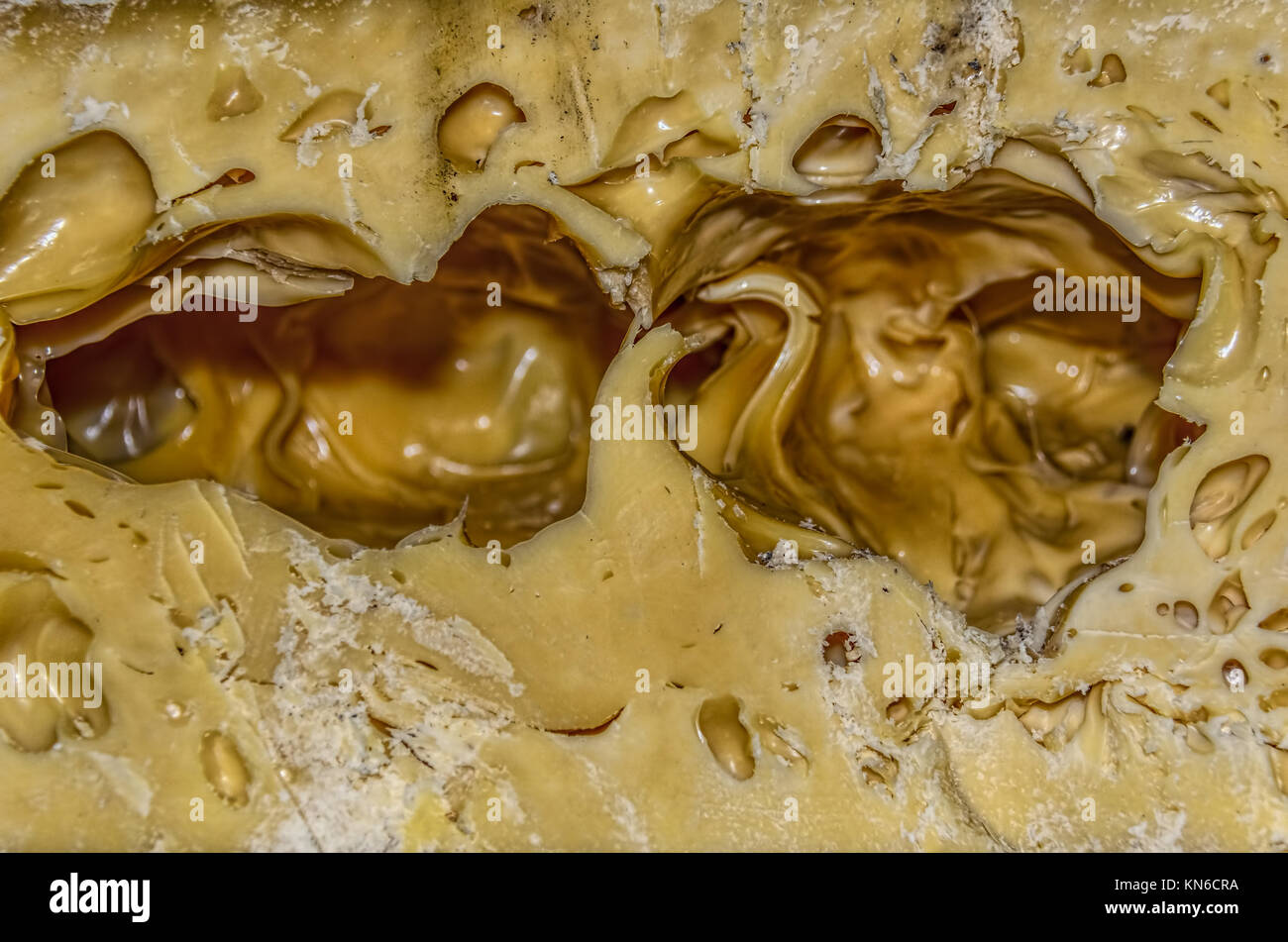 Closeup view of tasty yellow Gruyere cheese Stock Photo - Alamy