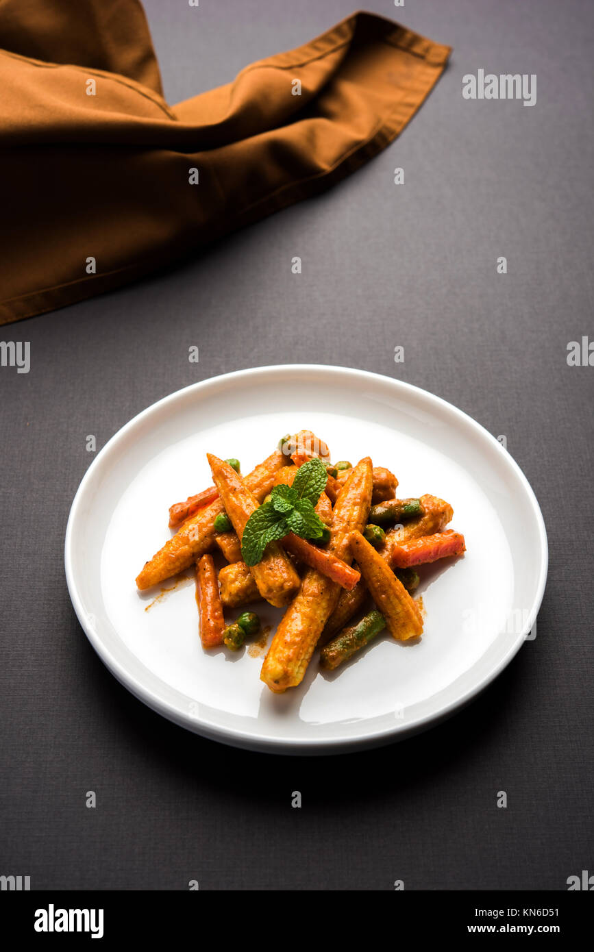 Indian Baby Corn Masala or spicy Baby corn curry served with roti or ...