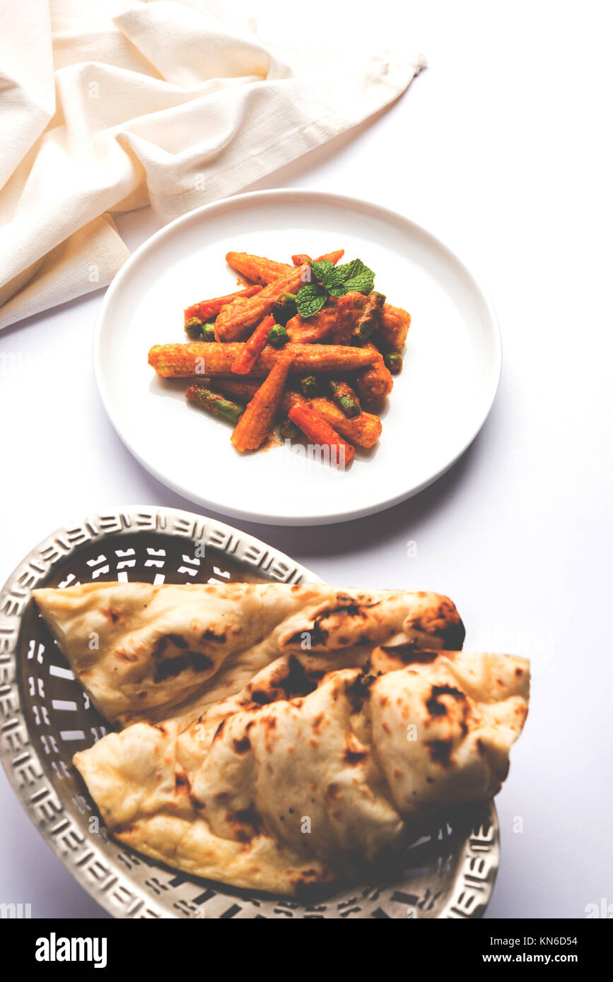 Indian Baby Corn Masala or spicy Baby corn curry served with roti or ...