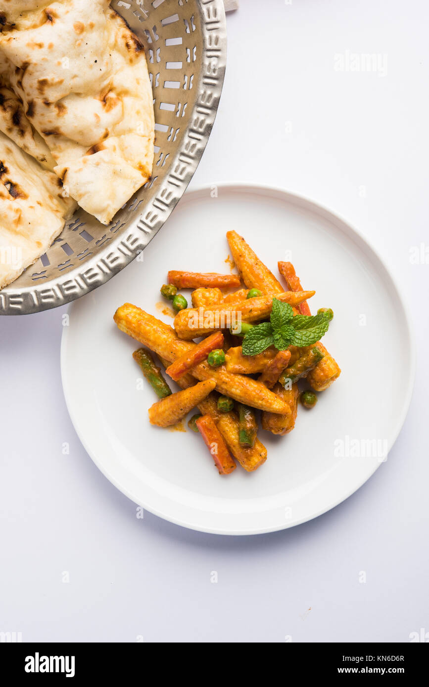 Indian Baby Corn Masala or spicy Baby corn curry served with roti or ...