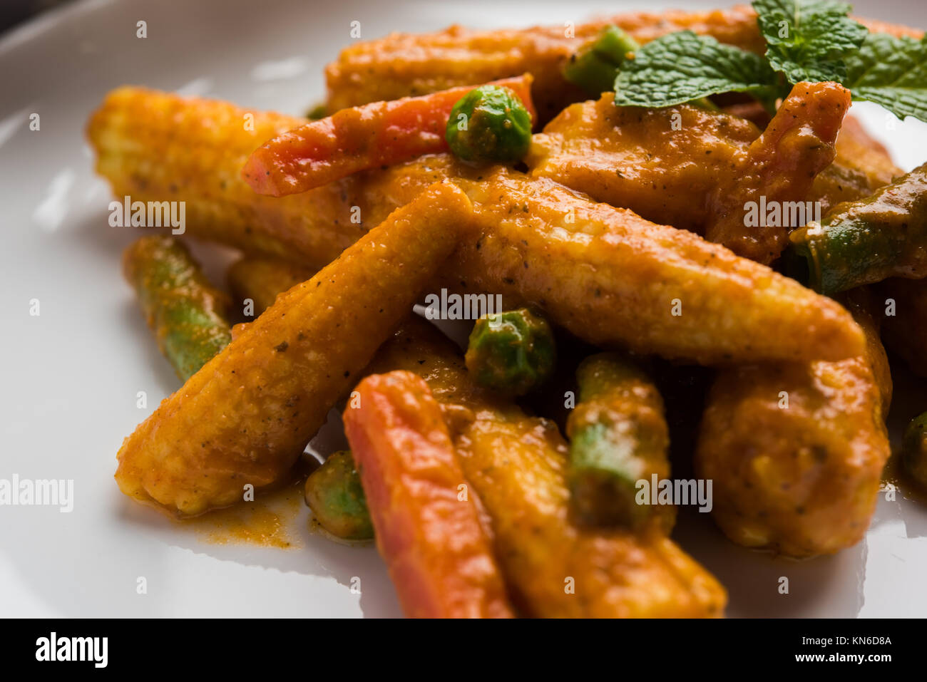 Indian Baby Corn Masala or spicy Baby corn curry served with roti or ...
