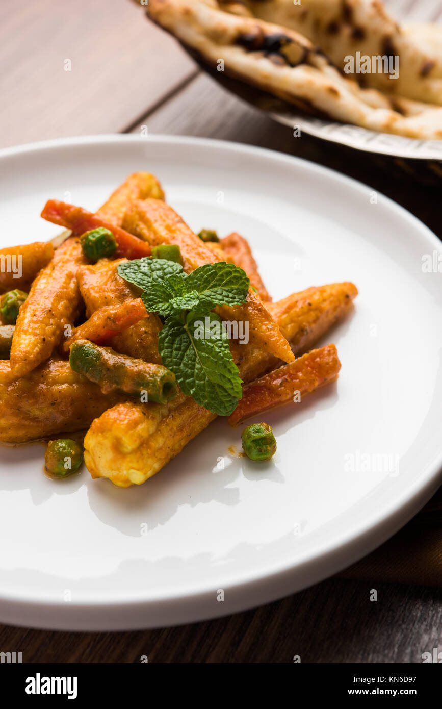 Indian Baby Corn Masala or spicy Baby corn curry served with roti or ...