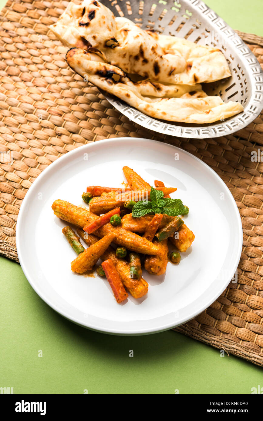 Indian Baby Corn Masala or spicy Baby corn curry served with roti or ...