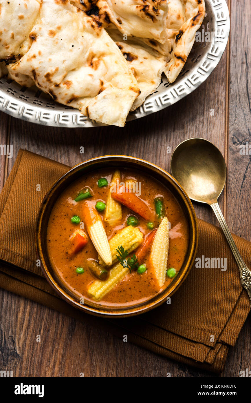 Indian Baby Corn Masala or spicy Baby corn curry served with roti or ...
