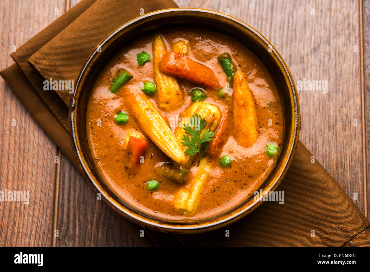 Indian Baby Corn Masala or spicy Baby corn curry served with roti or ...