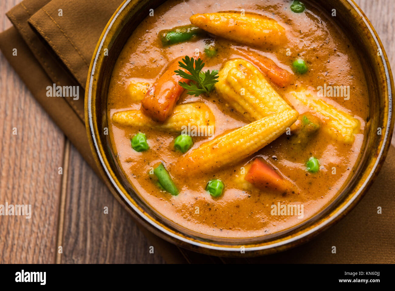 Indian Baby Corn Masala or spicy Baby corn curry served with roti or ...