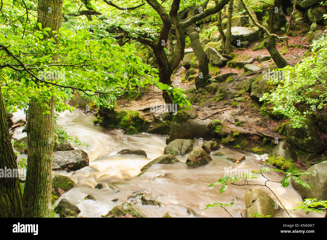 Water flowing through rocks Stock Photo - Alamy