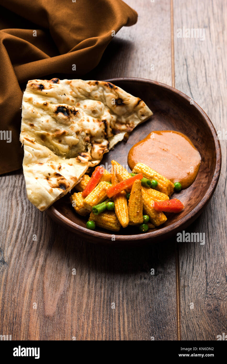 Indian Baby Corn Masala or spicy Baby corn curry served with roti or ...