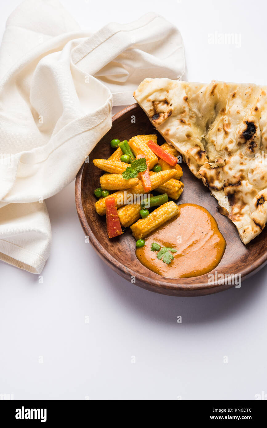 Indian Baby Corn Masala or spicy Baby corn curry served with roti or ...