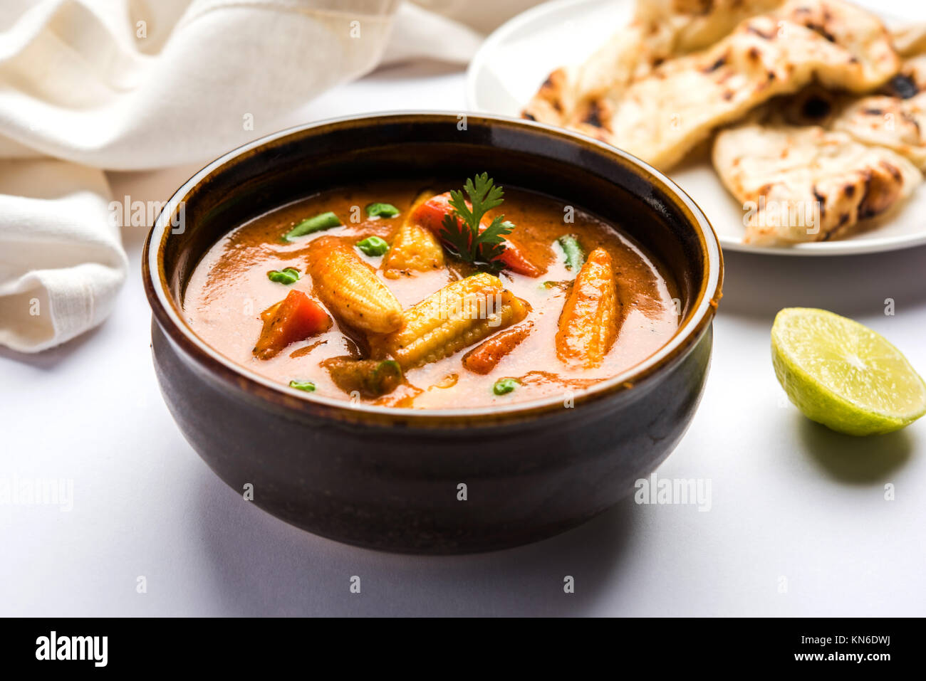Indian Baby Corn Masala or spicy Baby corn curry served with roti or ...
