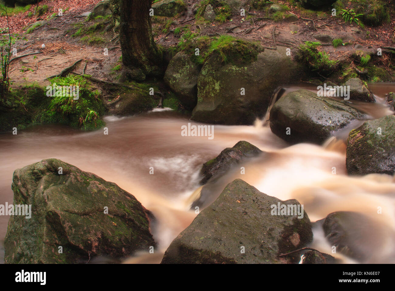 Water flowing through rocks Stock Photo - Alamy