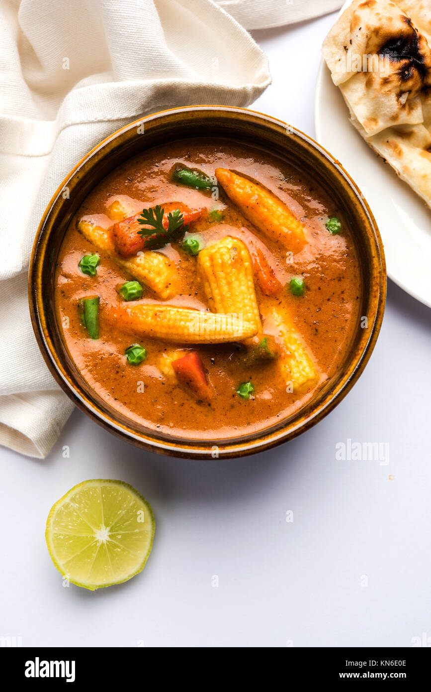 Indian Baby Corn Masala or spicy Baby corn curry served with roti or ...