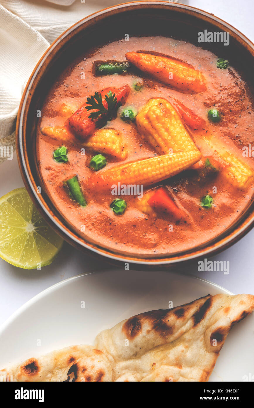 Indian Baby Corn Masala or spicy Baby corn curry served with roti or ...