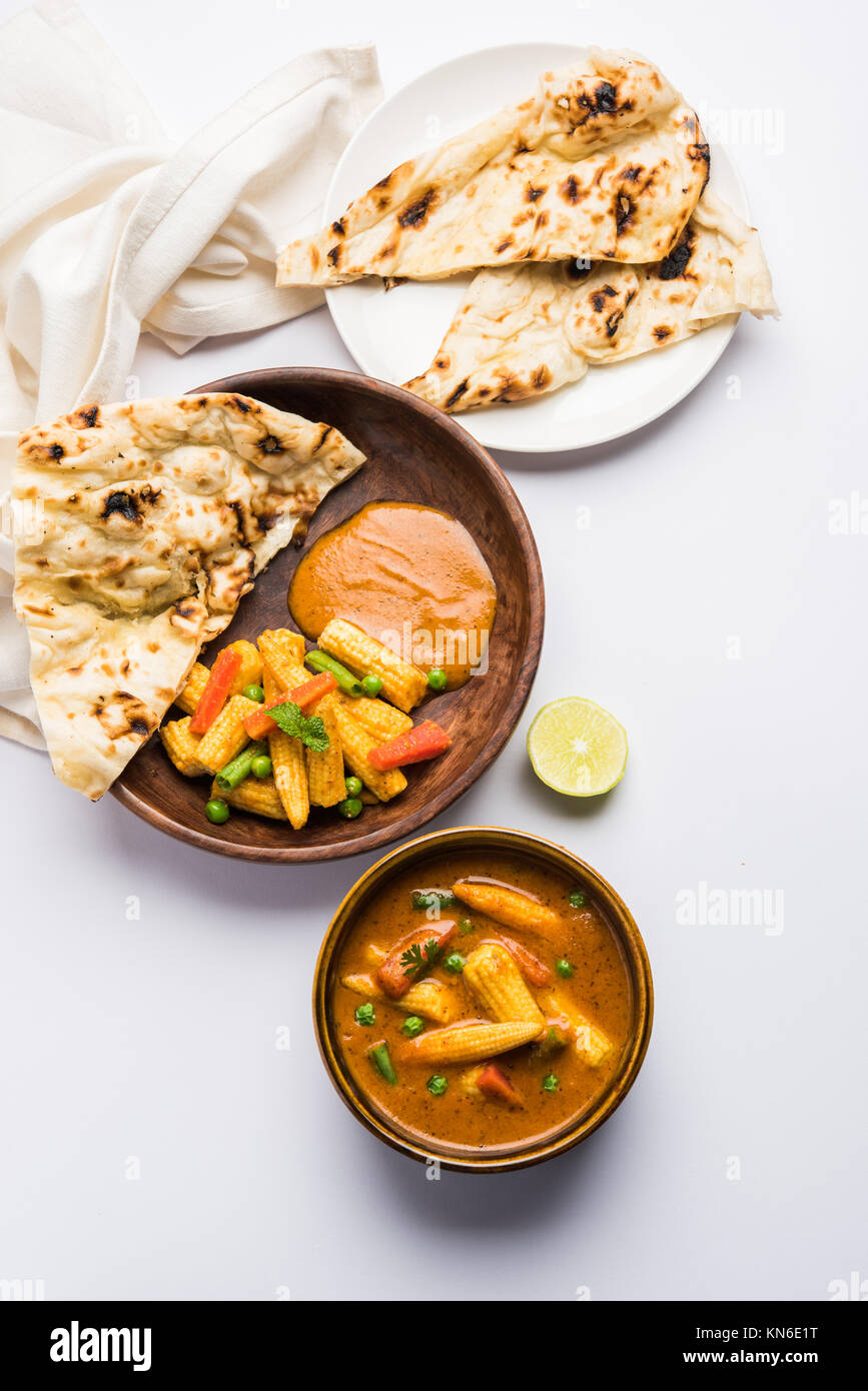 Indian Baby Corn Masala or spicy Baby corn curry served with roti or ...