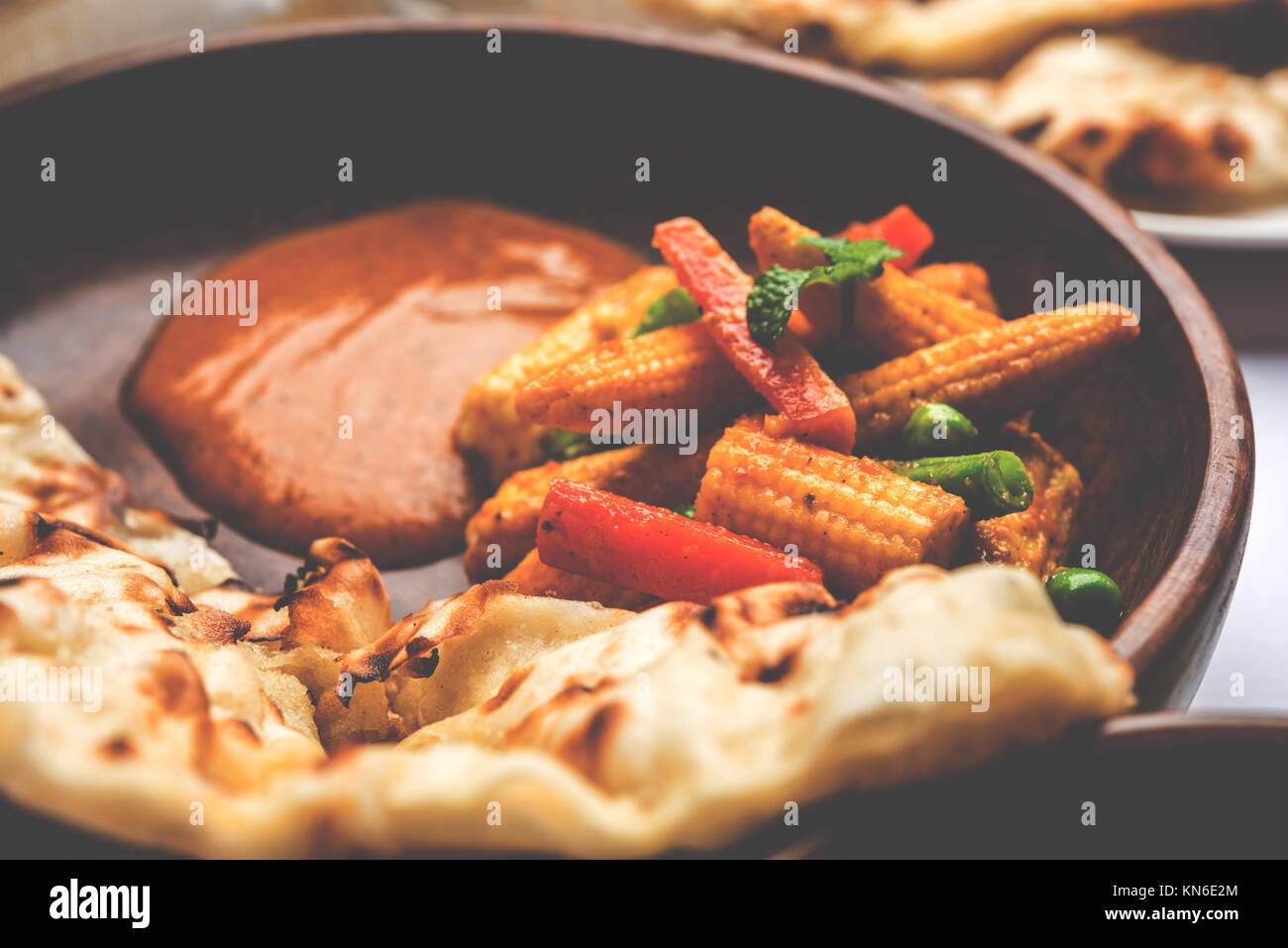 Indian Baby Corn Masala or spicy Baby corn curry served with roti or ...