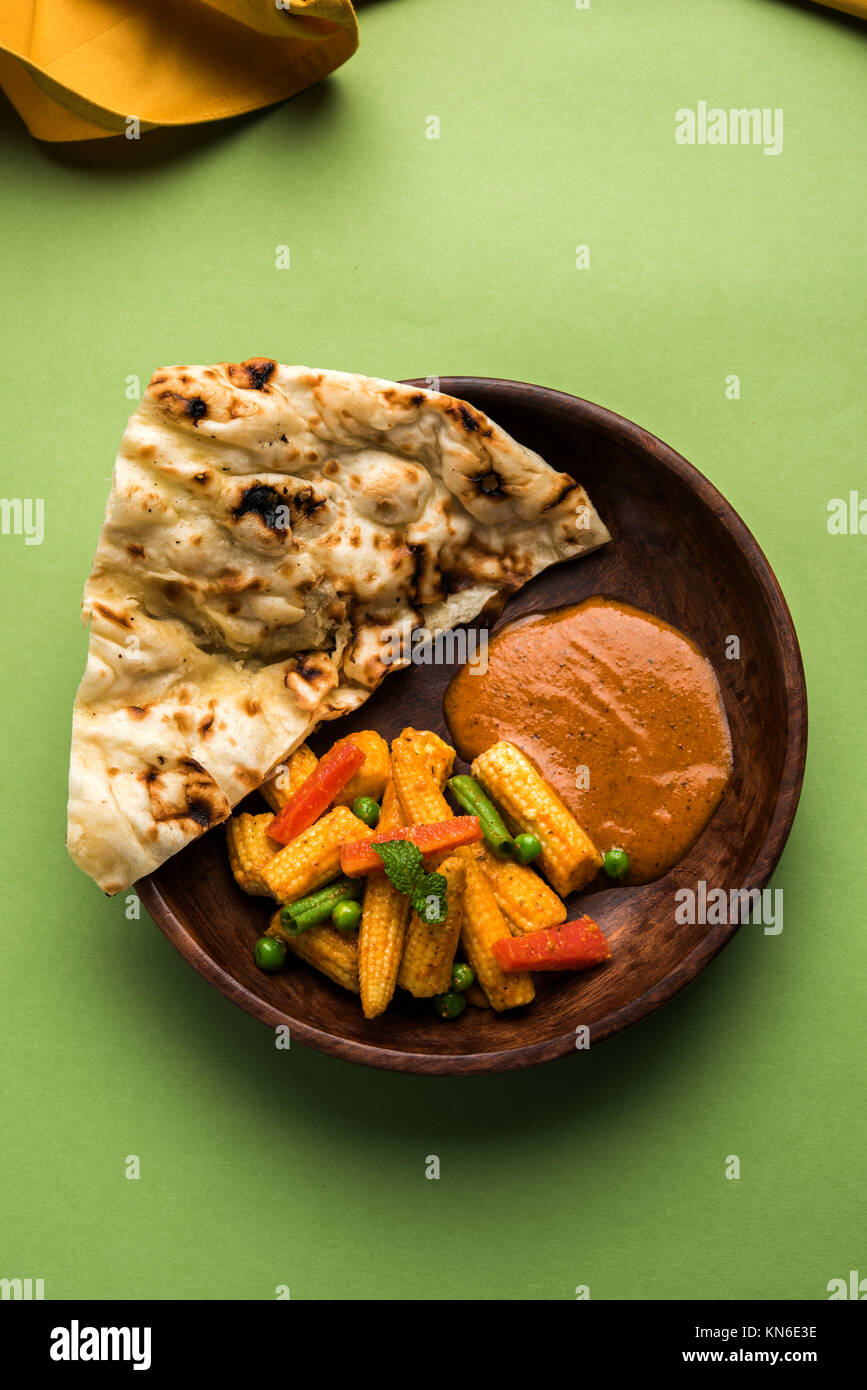 Indian Baby Corn Masala or spicy Baby corn curry served with roti or ...