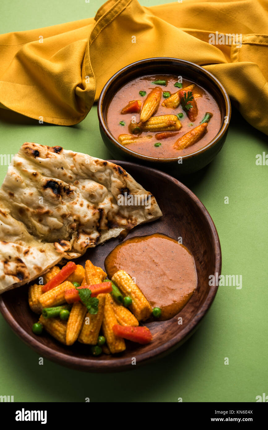 Indian Baby Corn Masala or spicy Baby corn curry served with roti or ...