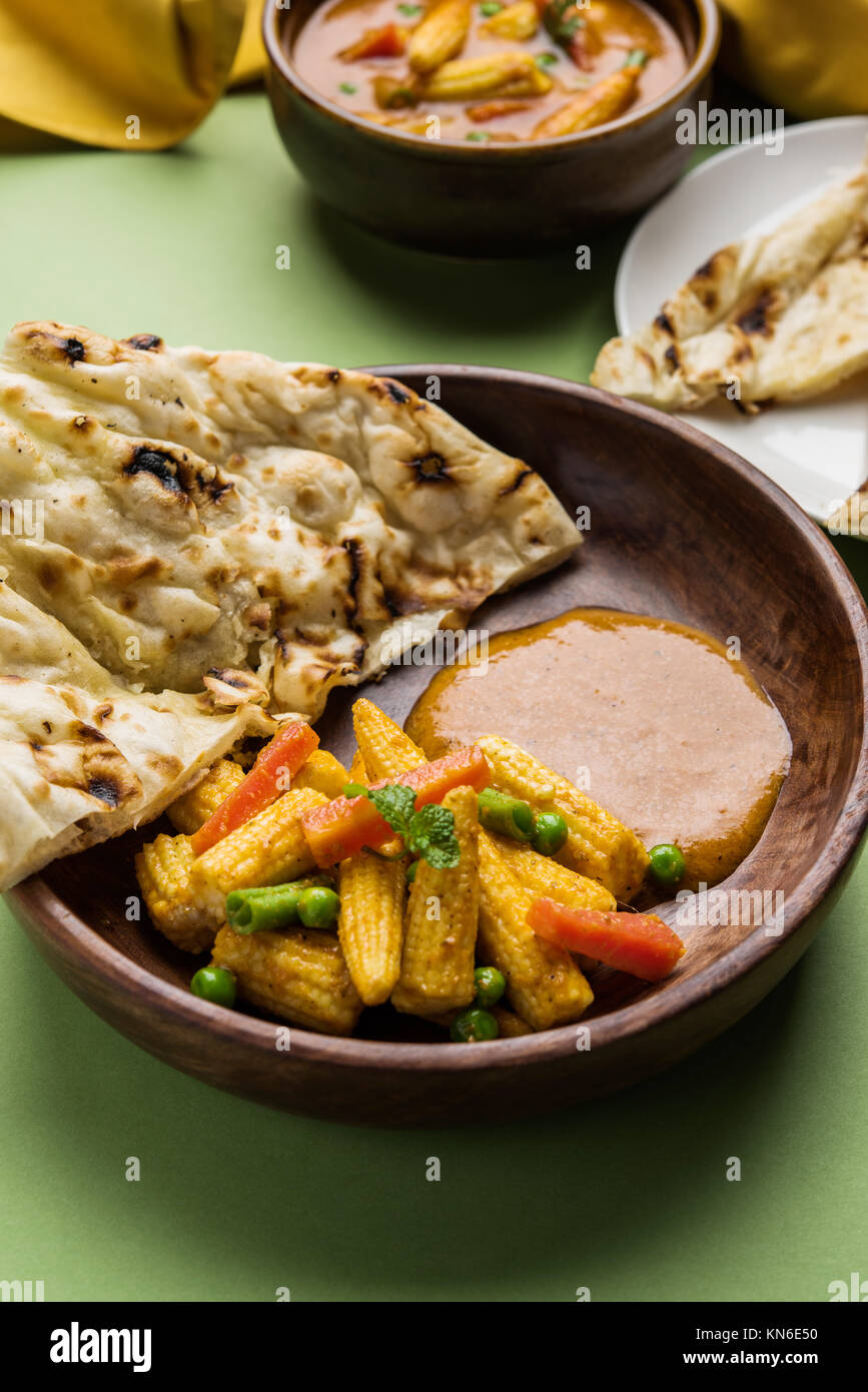 Indian Baby Corn Masala or spicy Baby corn curry served with roti or ...