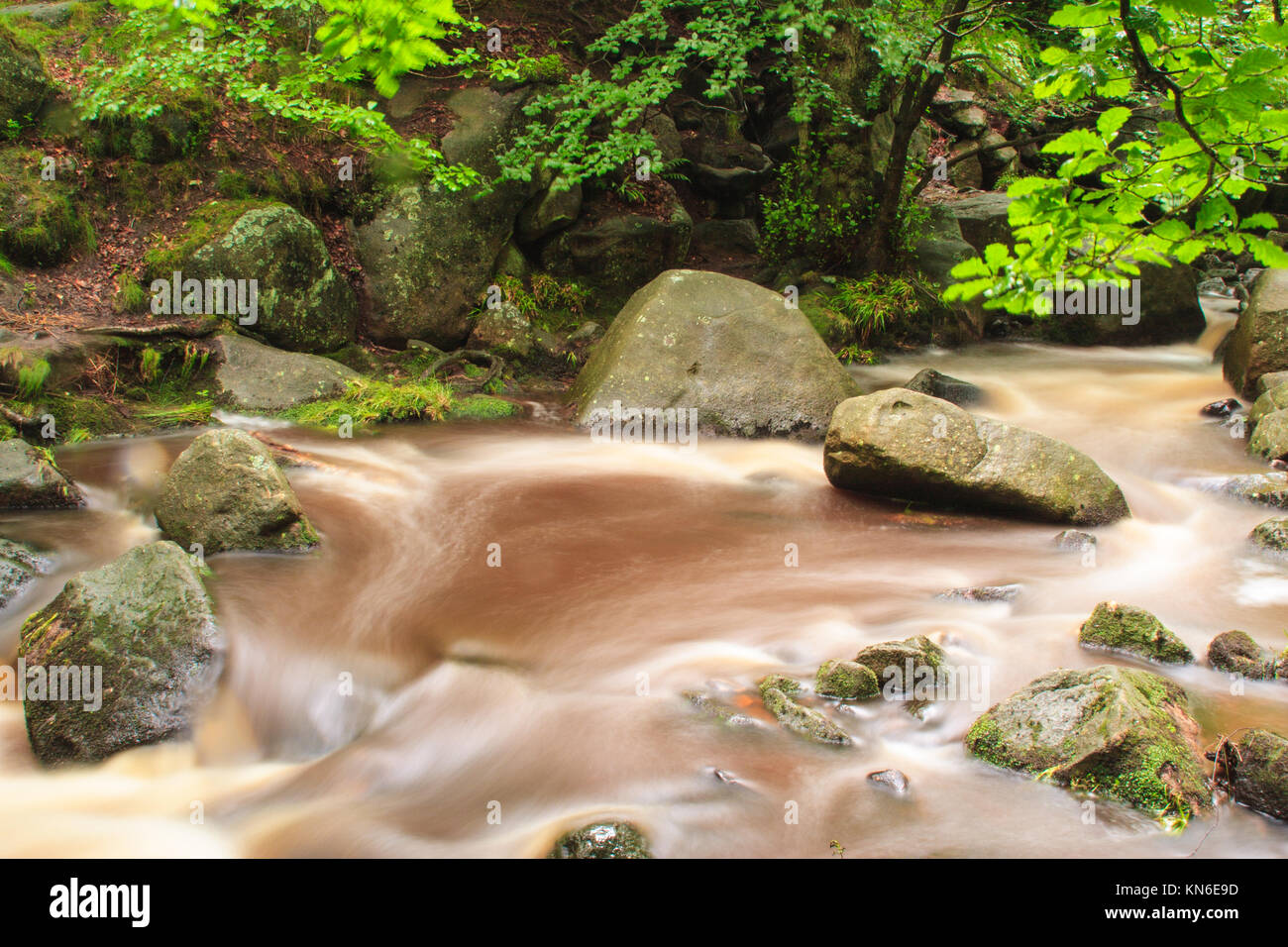 Water flowing through rocks Stock Photo - Alamy