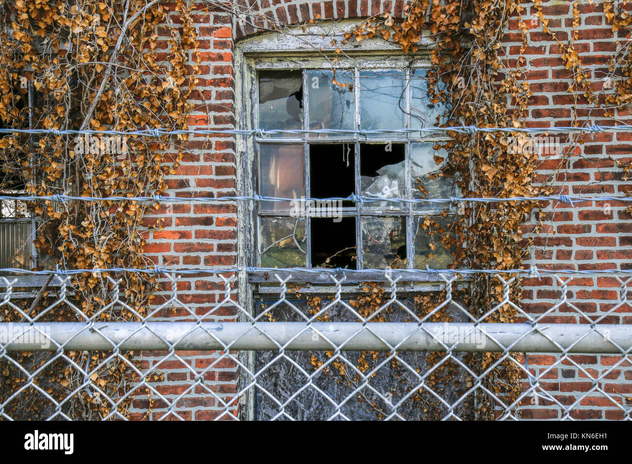 Abandoned Brick Building Broken Windows Behind Barb Wire and Chain ...