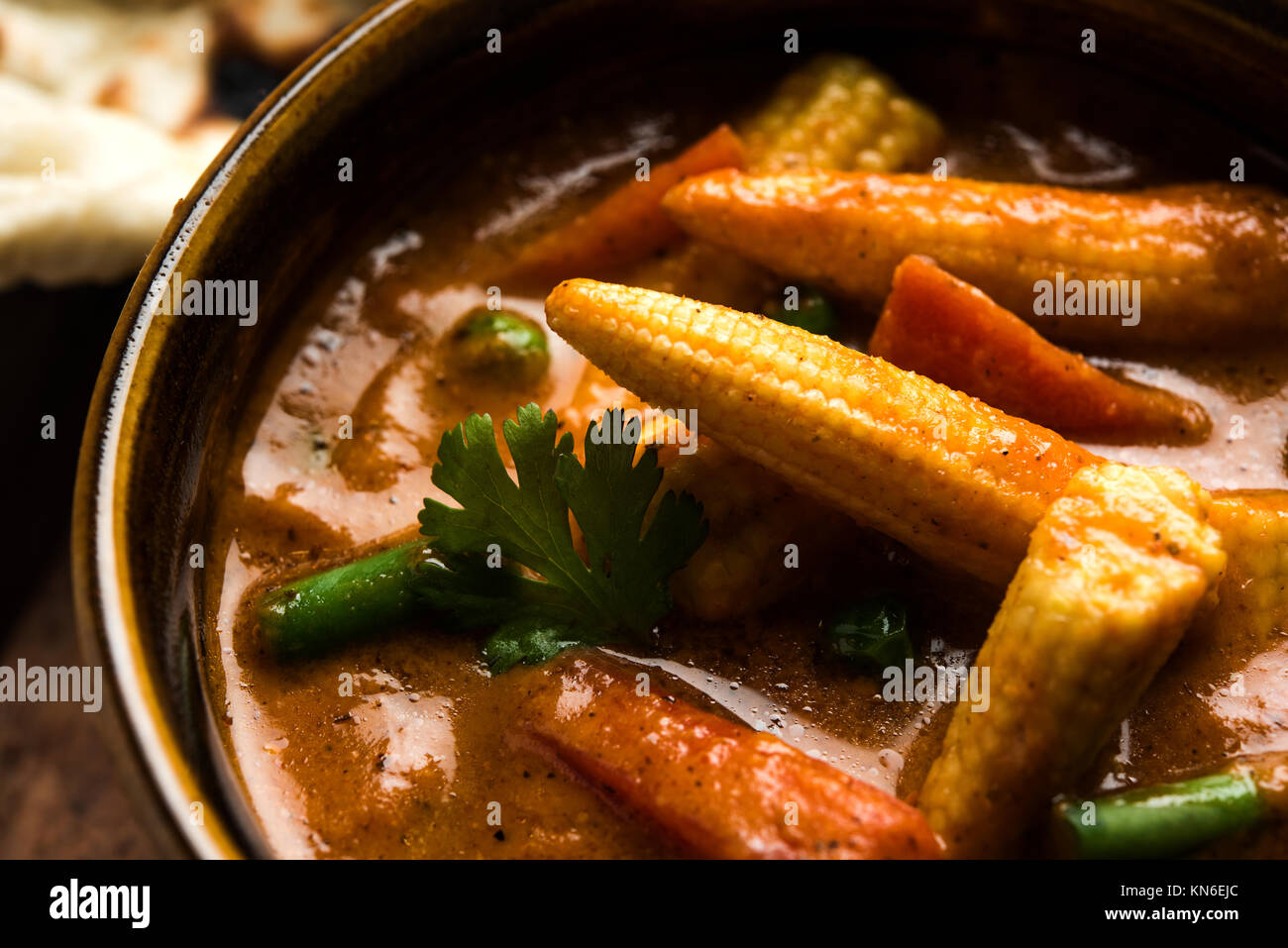 Indian Baby Corn Masala or spicy Baby corn curry served with roti or ...