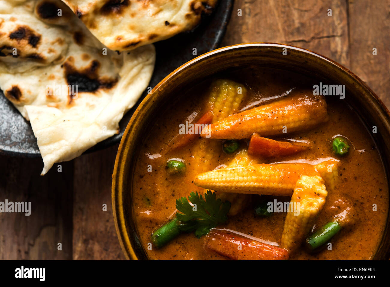 Indian Baby Corn Masala or spicy Baby corn curry served with roti or ...