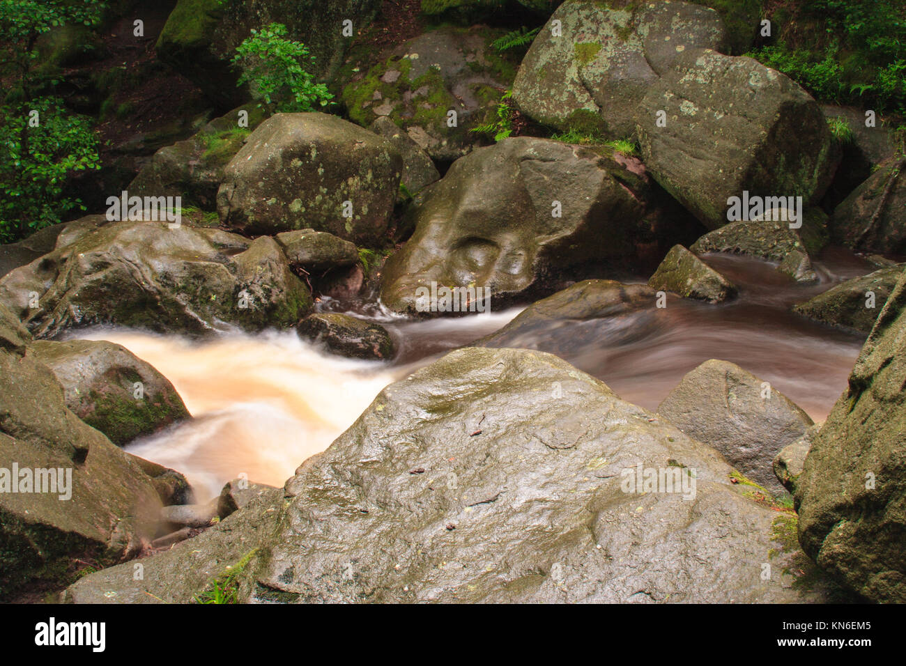 Water flowing through rocks Stock Photo - Alamy