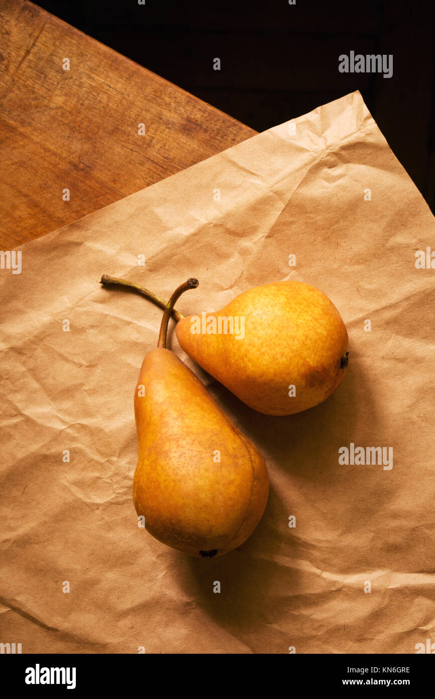 Two sweet pears on wrapping paper, top view Stock Photo - Alamy