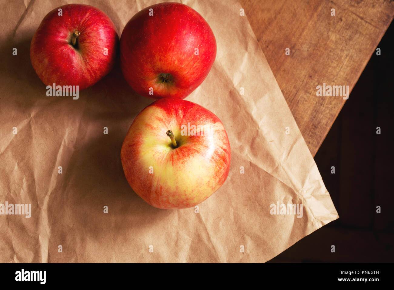 Fresh sweet red apples on wrapping paper, top view Stock Photo - Alamy