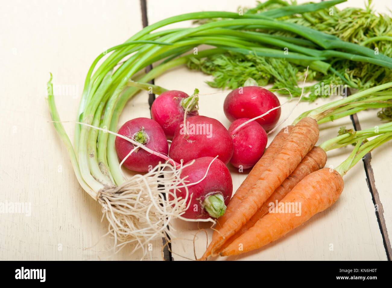 raw root vegetable on a rustic white wood table Stock Photo - Alamy