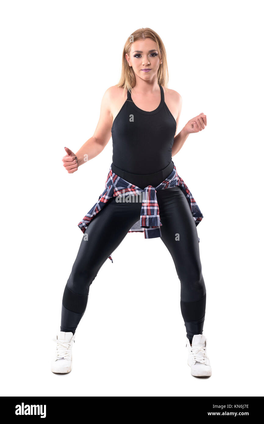 Front view of attractive blonde woman dancing jazz dance aerobics ...
