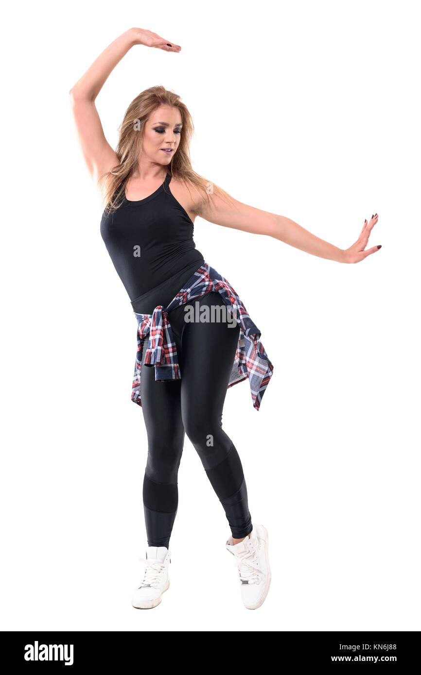 Posture of young attractive woman dancer swinging arms and dancing ...