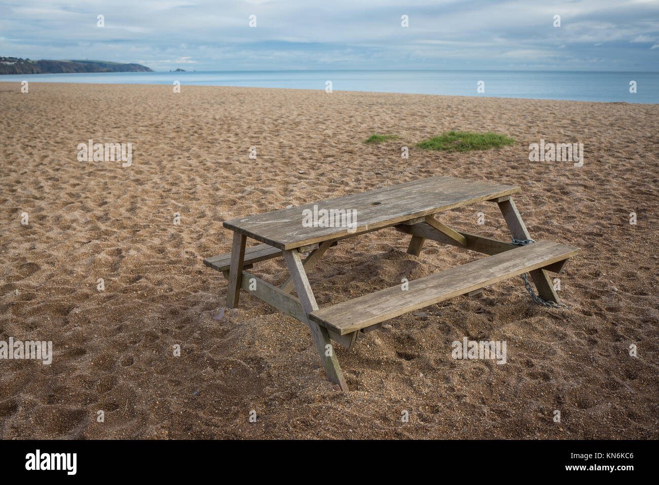 Wooden bench on the beach Stock Photo - Alamy