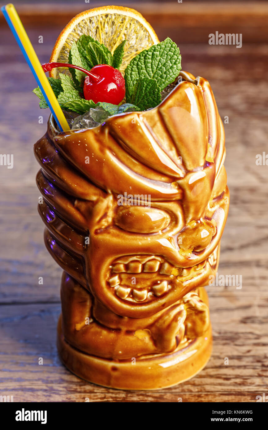 Exotic cocktail rum runner decorated with cherries, mint and orange ...