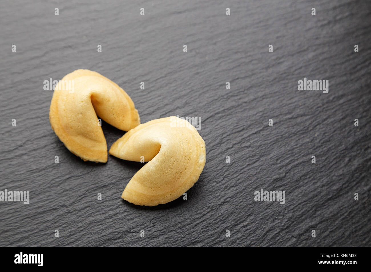 traditional Chinese cookies with wishes on a black background. place ...